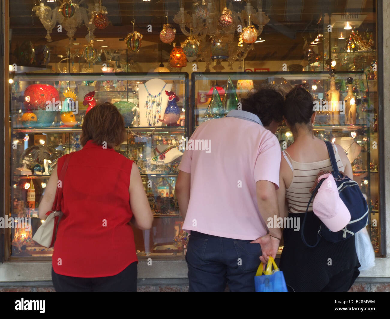 people by glass gift shop window on murano island, venice Stock Photo ...