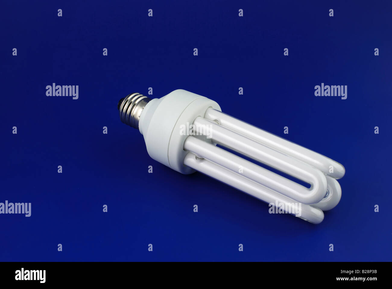Lamp An electric economic lamp on a dark blue background Stock Photo ...