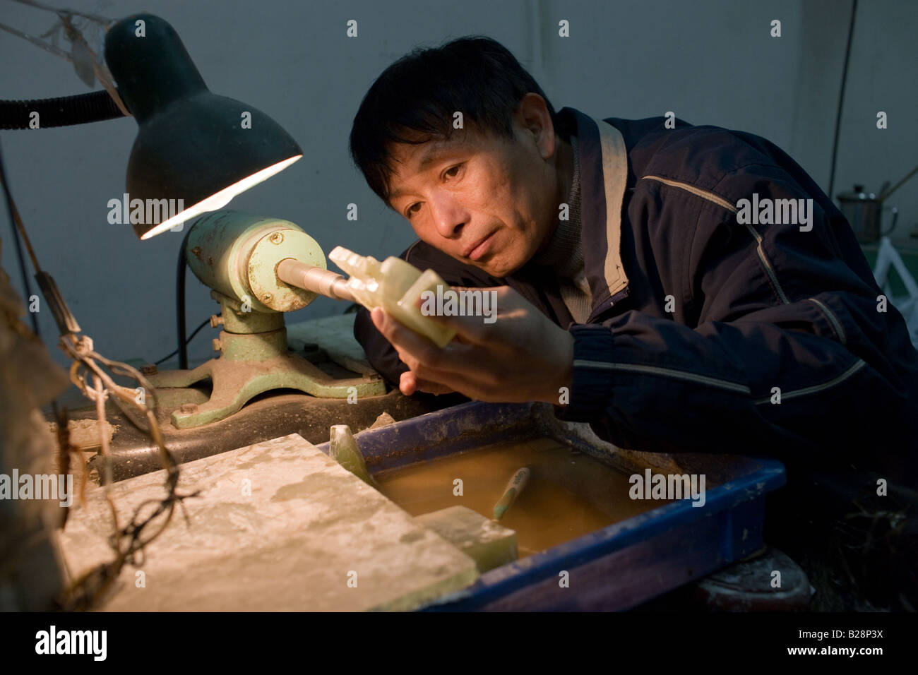 Jade craftsman at work in the Huahui Jade Factory and Showroom Xian ...