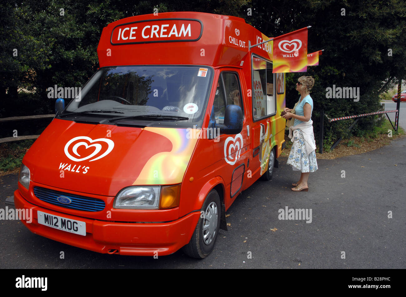 A lady buys ice cream cones from a van at the Seven Sisters Country ...