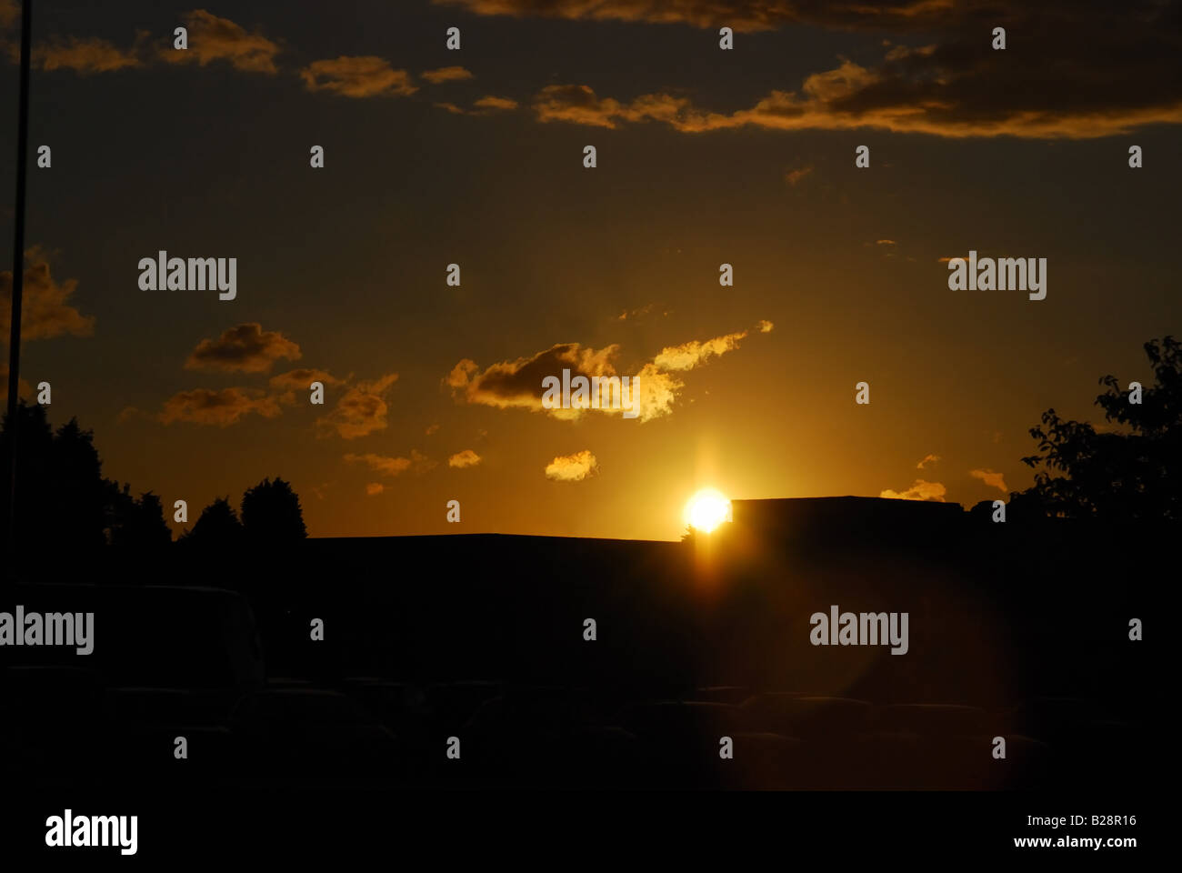 Sunset over a building Stock Photo - Alamy