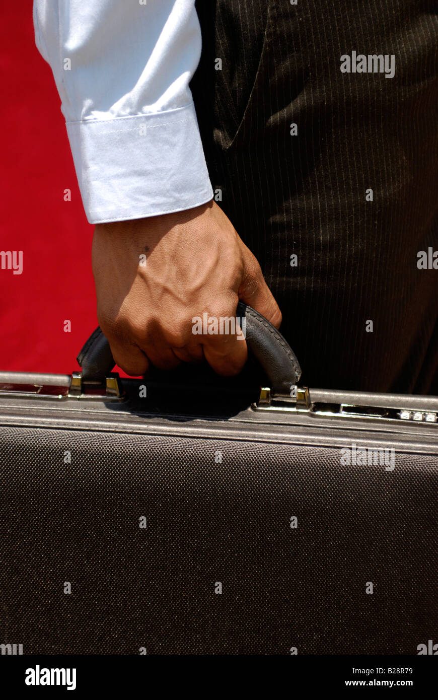 Hand Holding Briefcase Stock Photo - Alamy