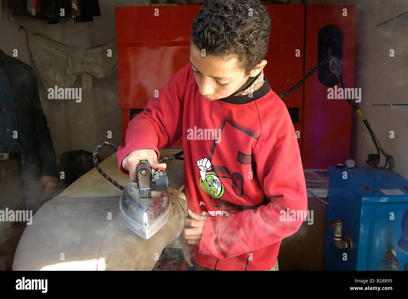 A thirteen years old boy, Ahmed, is working every day ten hours in an ...