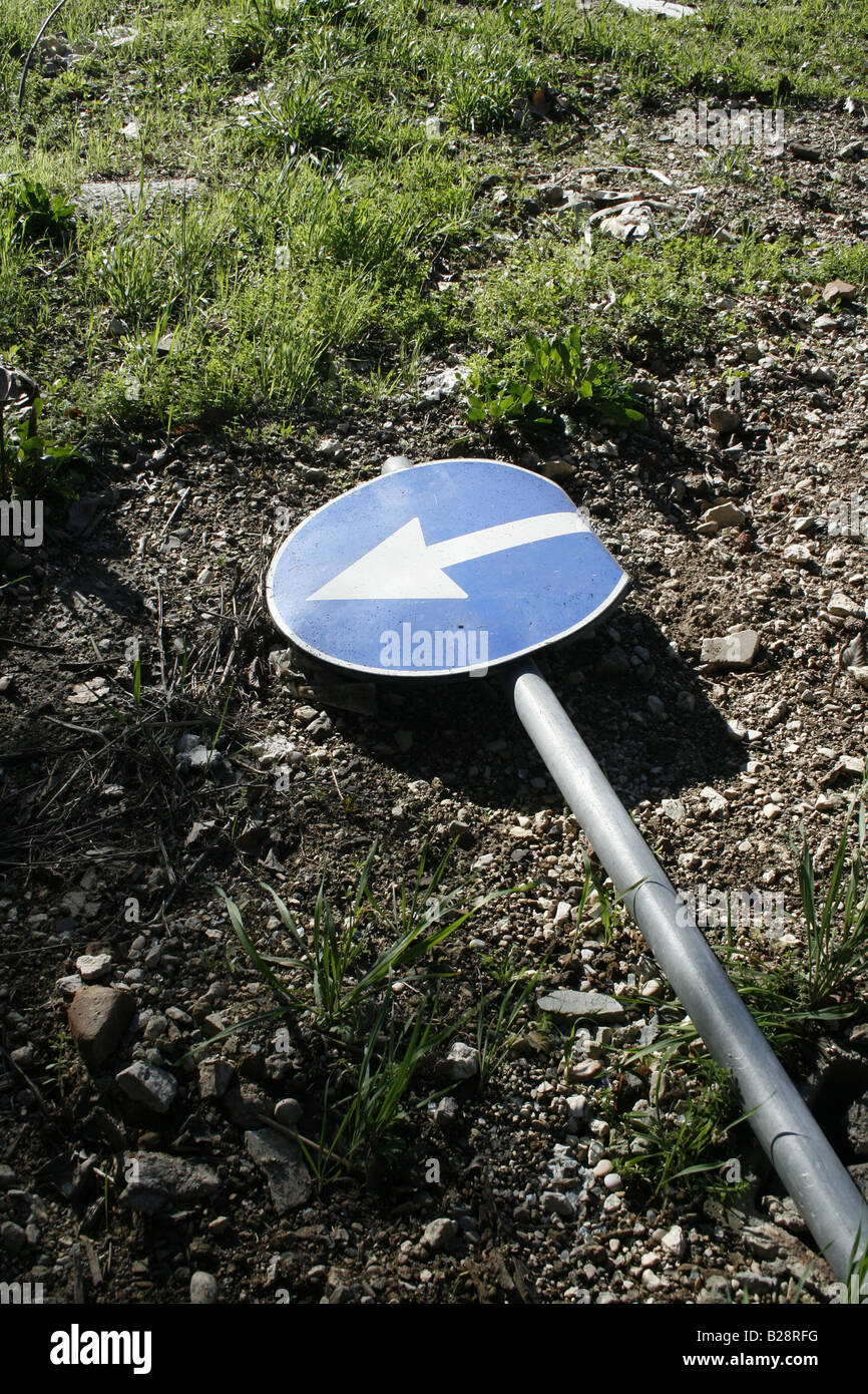 damaged road traffic sign notice left in field Stock Photo - Alamy