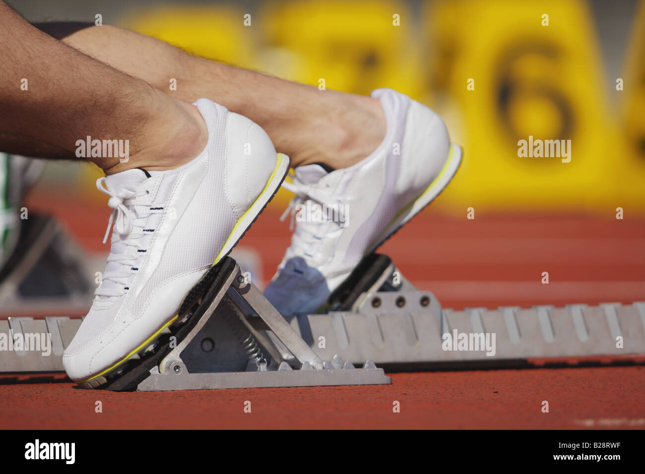 Runner at Starting Line Stock Photo - Alamy