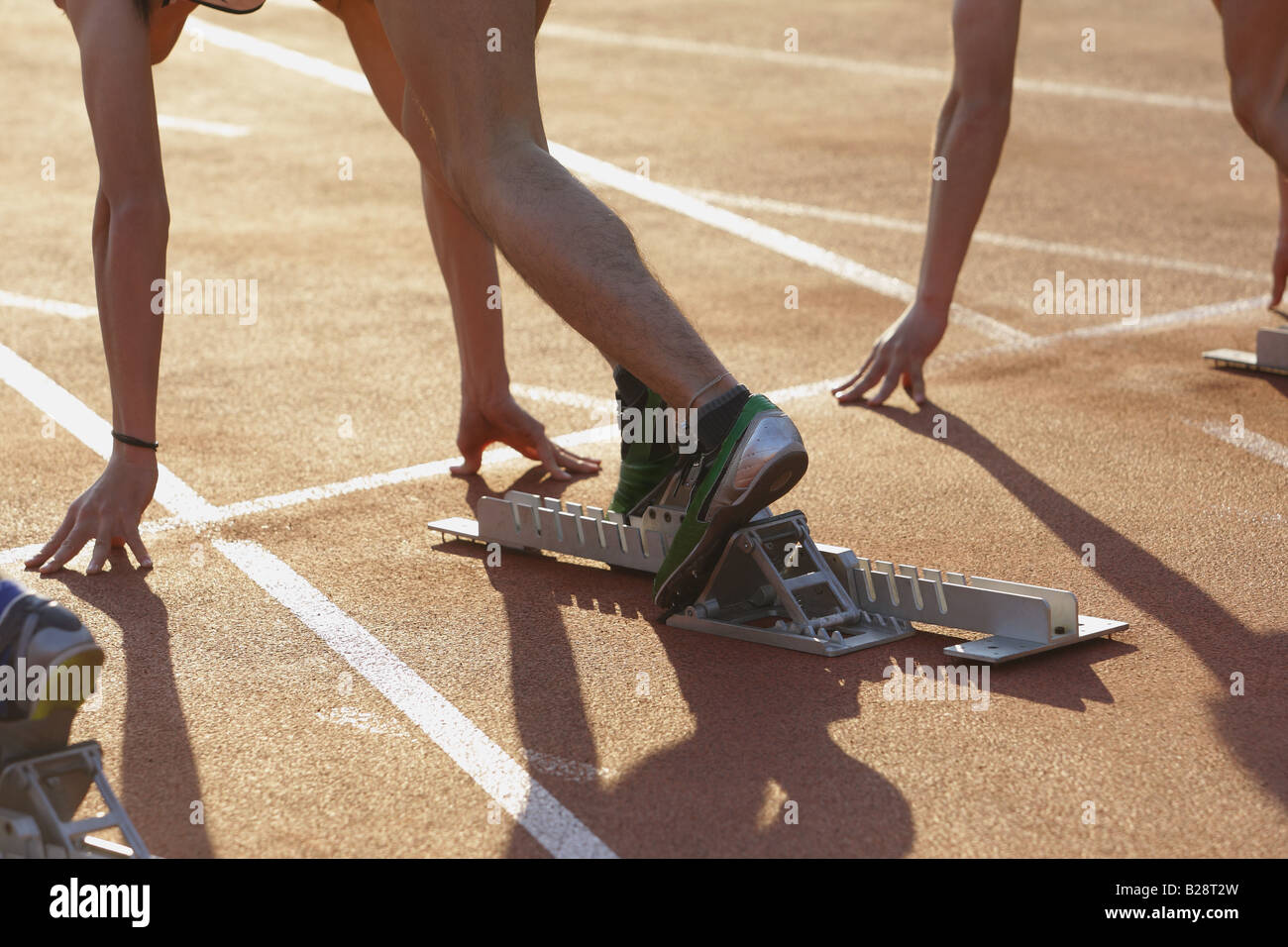 Runners at Starting Line Stock Photo - Alamy