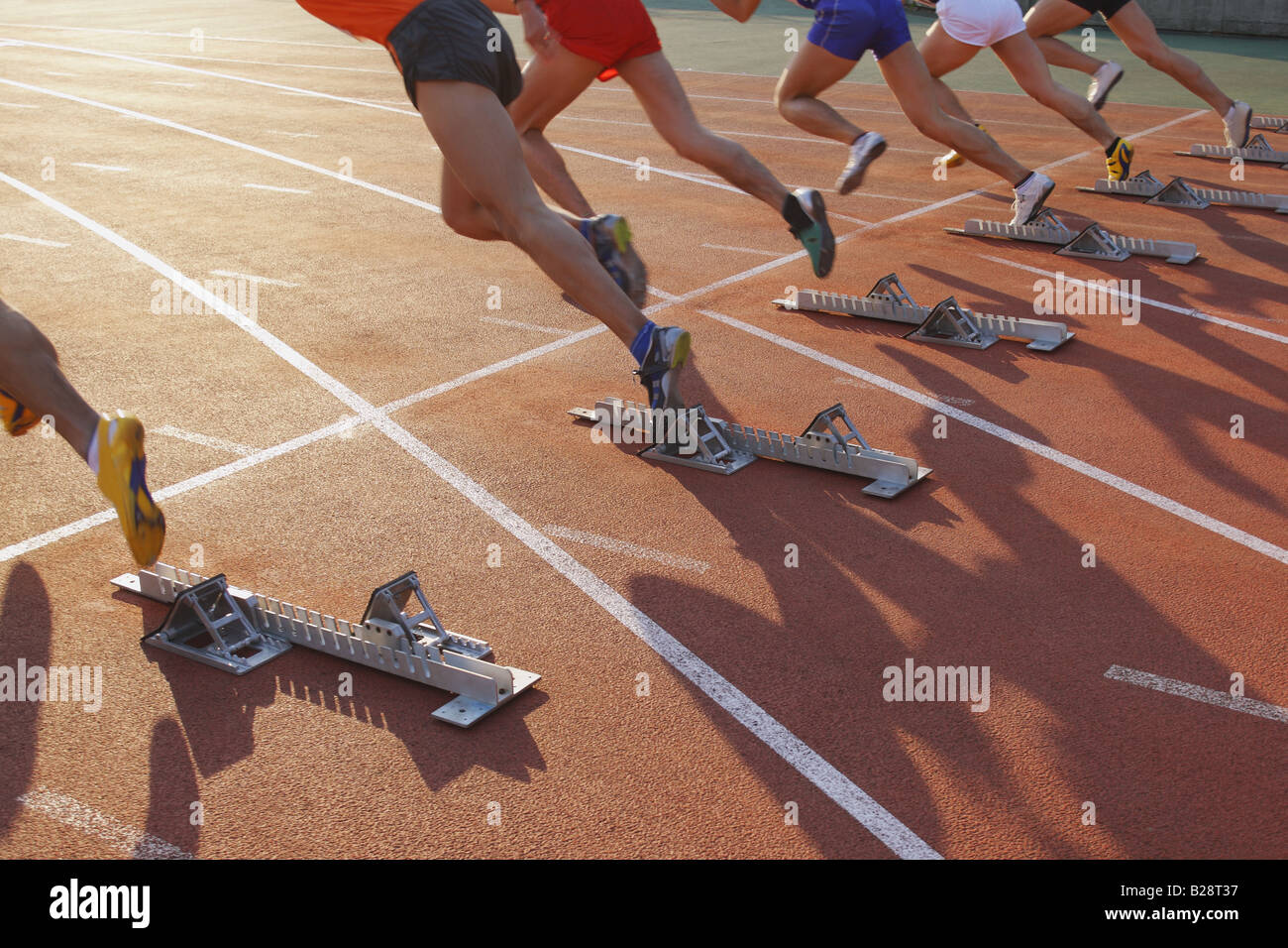 Runners Starting Off Stock Photo - Alamy