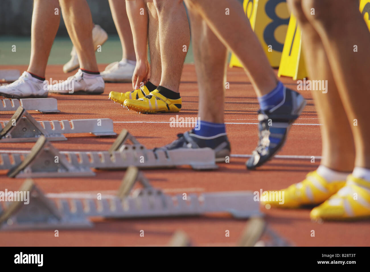 Runners at Starting Line Stock Photo - Alamy