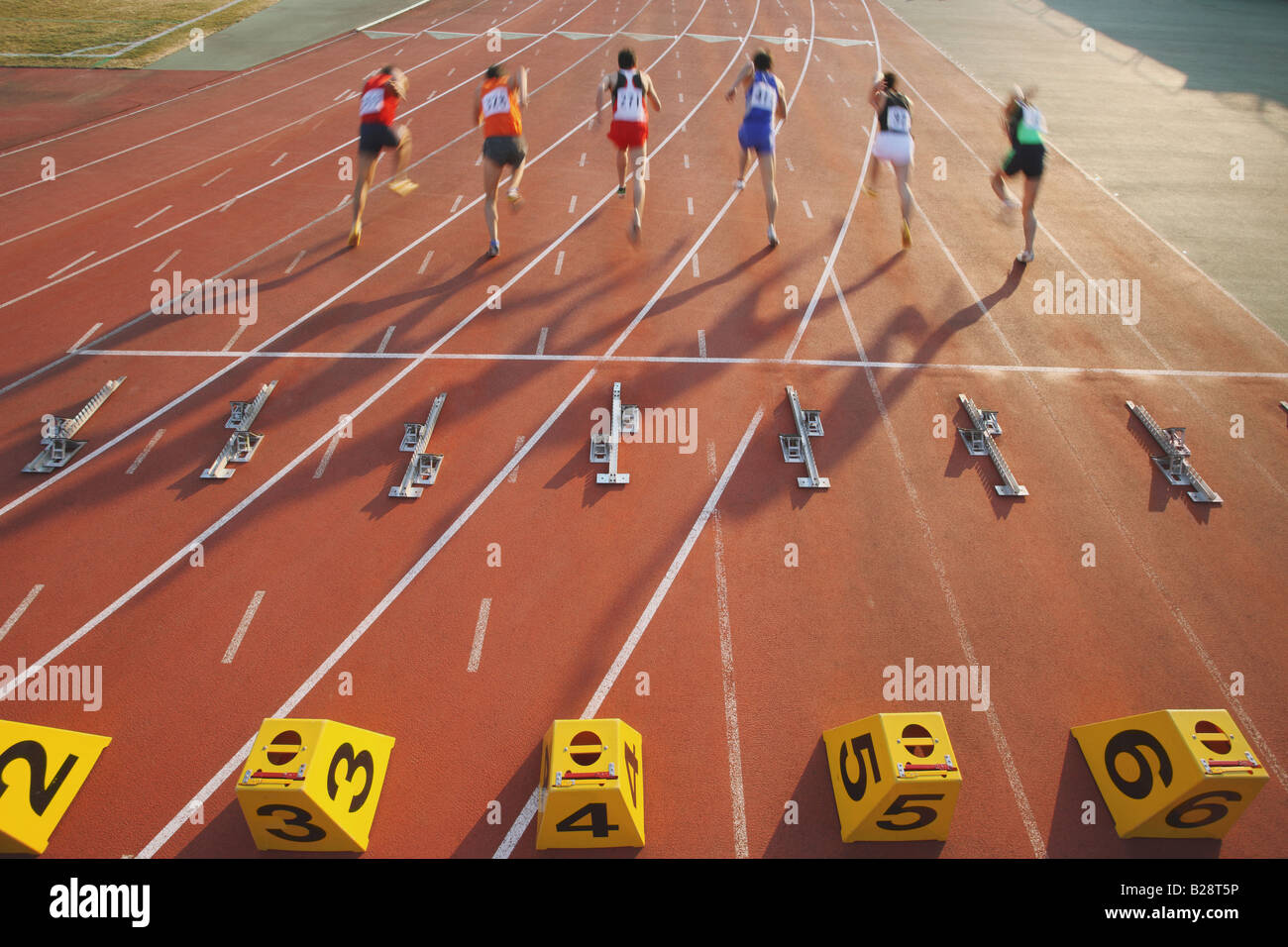 Runners Starting Off Stock Photo - Alamy
