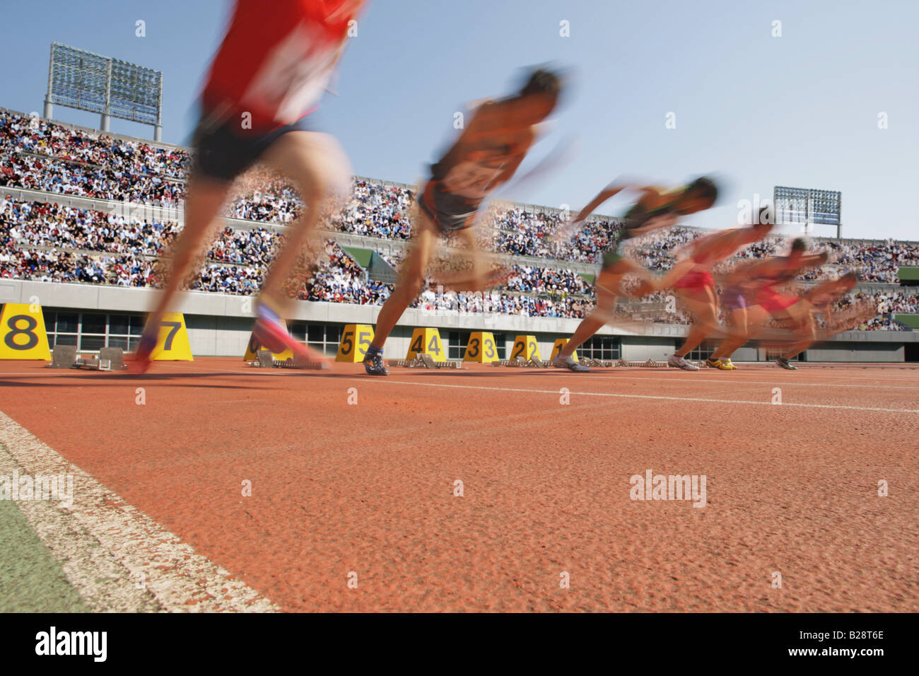 Runners Starting Off Stock Photo - Alamy