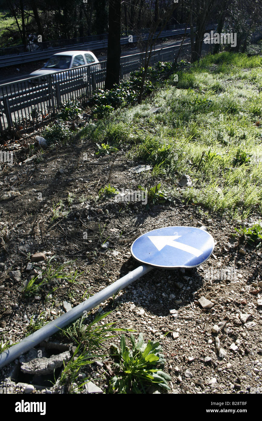 damaged road traffic sign notice left in field Stock Photo - Alamy