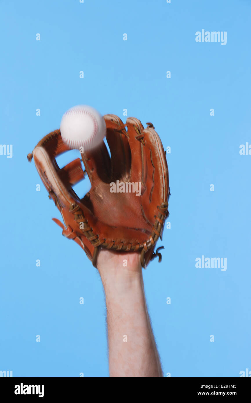Hand catching a ball hi-res stock photography and images - Alamy