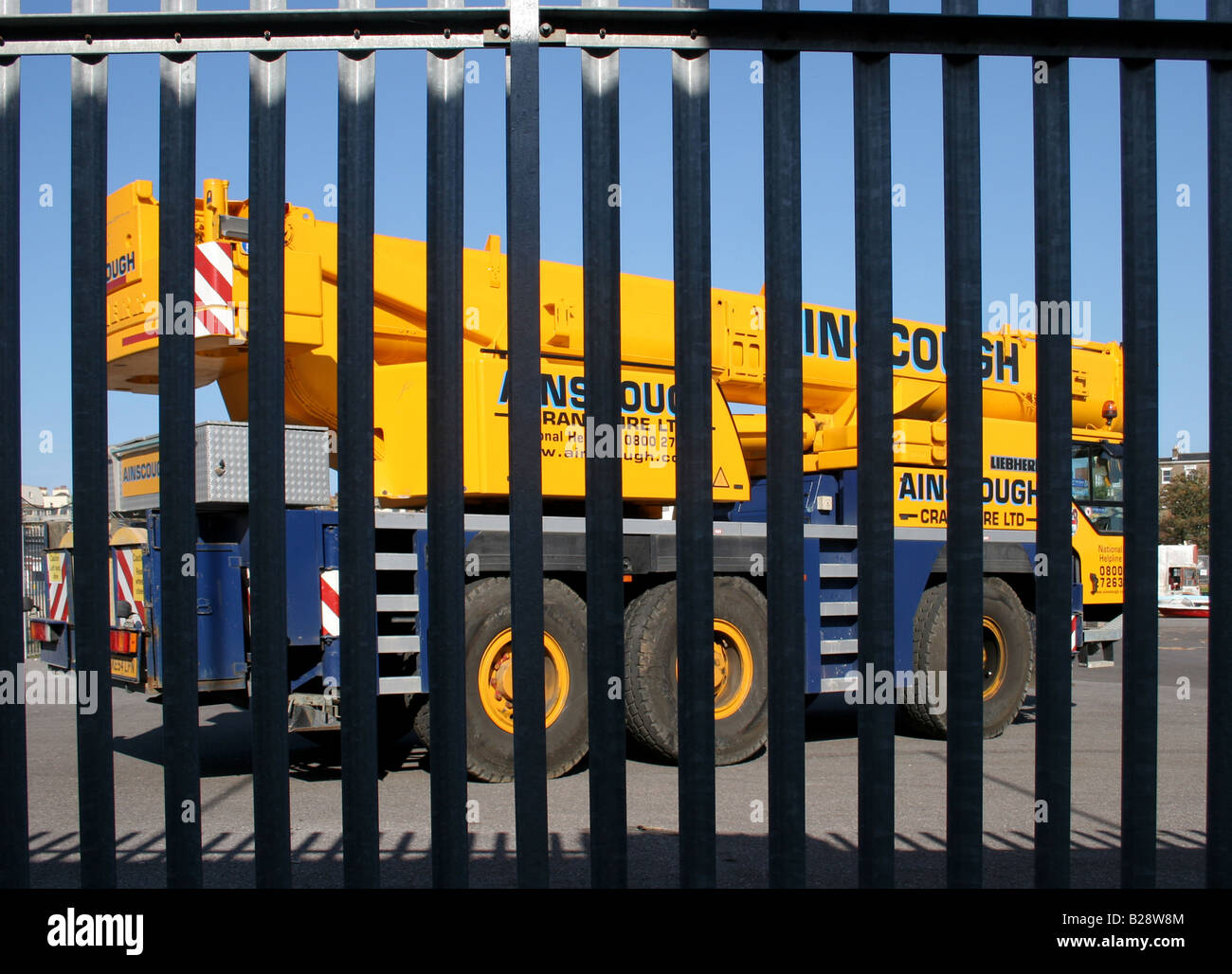30 ton mobile heavy lift crane seen though railings Stock Photo - Alamy