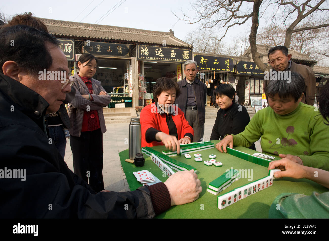 People gather to play Mahjong in the park by the City Wall Xian China ...