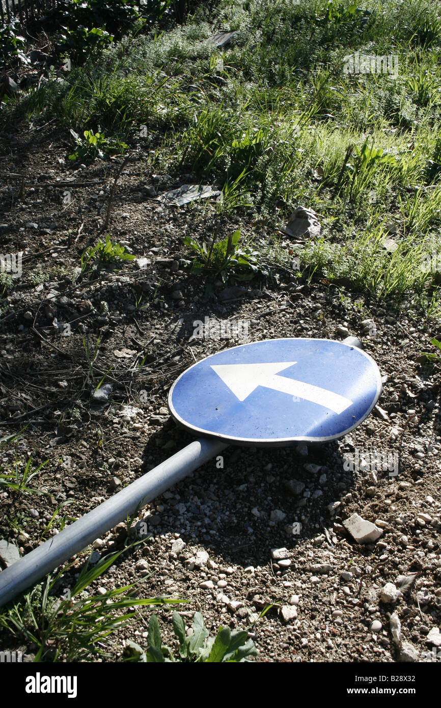 damaged road traffic sign notice left in field Stock Photo - Alamy