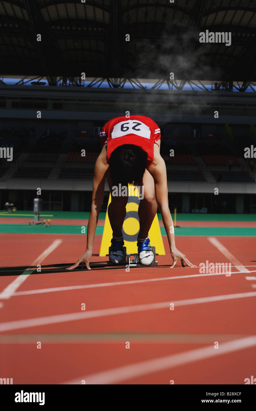 Runner at Starting Line Stock Photo - Alamy