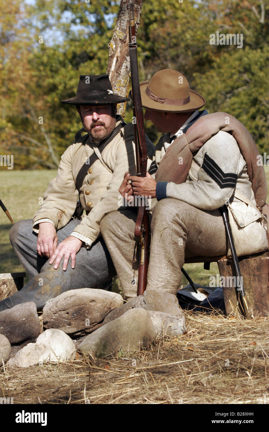 Two confederate soldiers talking around a campfire at a civil war ...