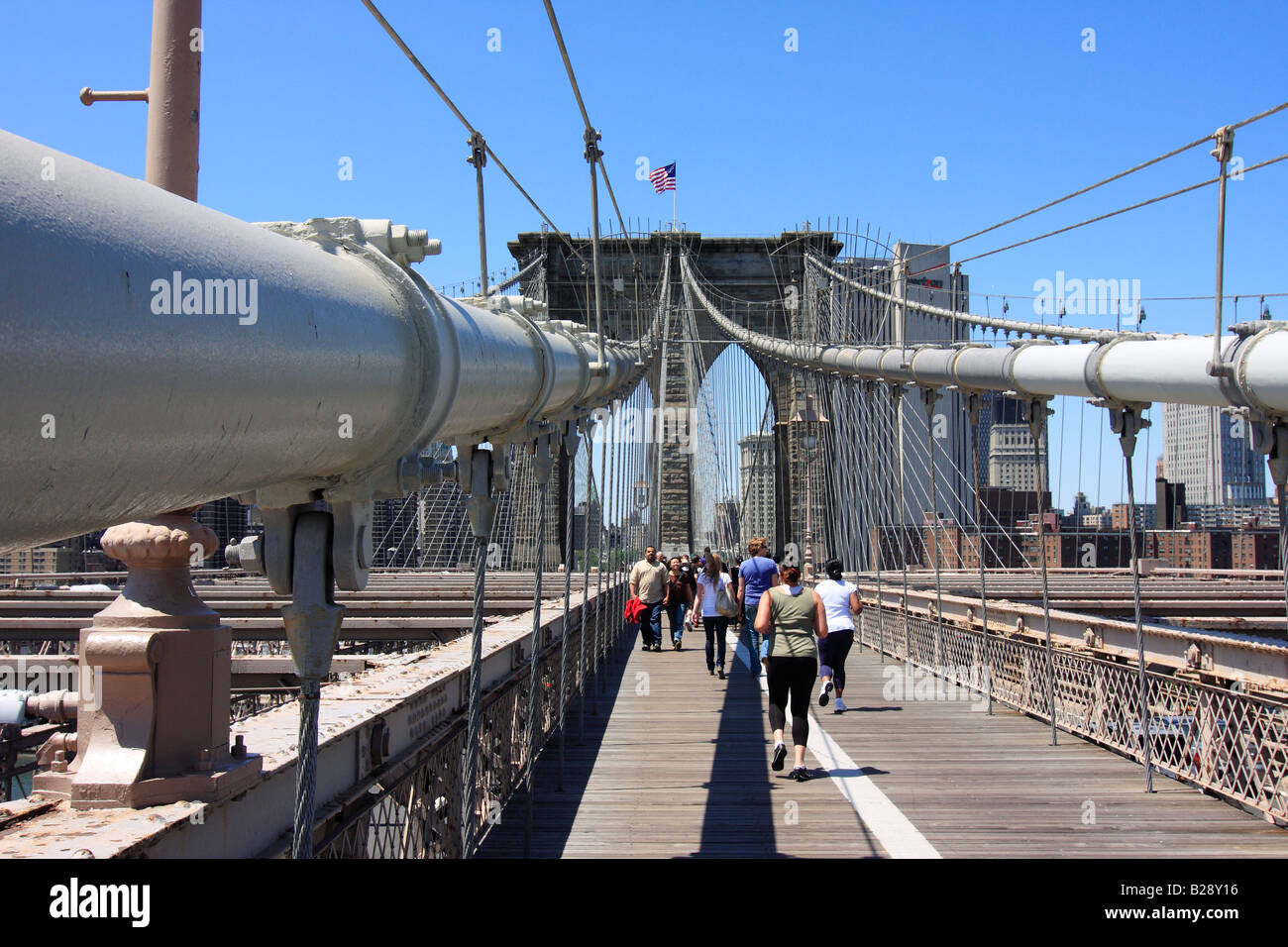 People walking on Brooklyn Bridge walkway - New York City, USA Stock ...