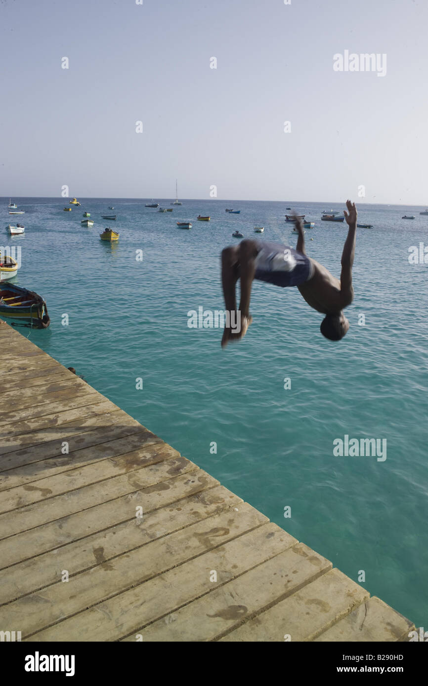 Child diving off Jetty Santa Maria Island of Sal Cape Verde Islands ...