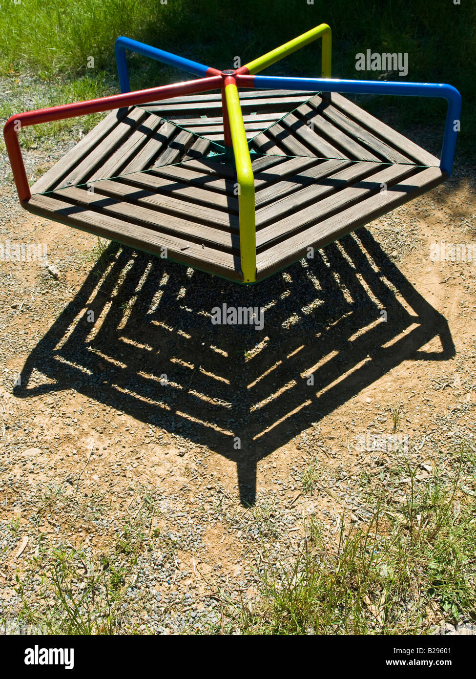 Roundabout in children's playground Stock Photo - Alamy