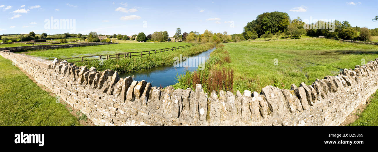 The River Coln at the Cotswold village of Coln Rogers, Gloucestershire ...