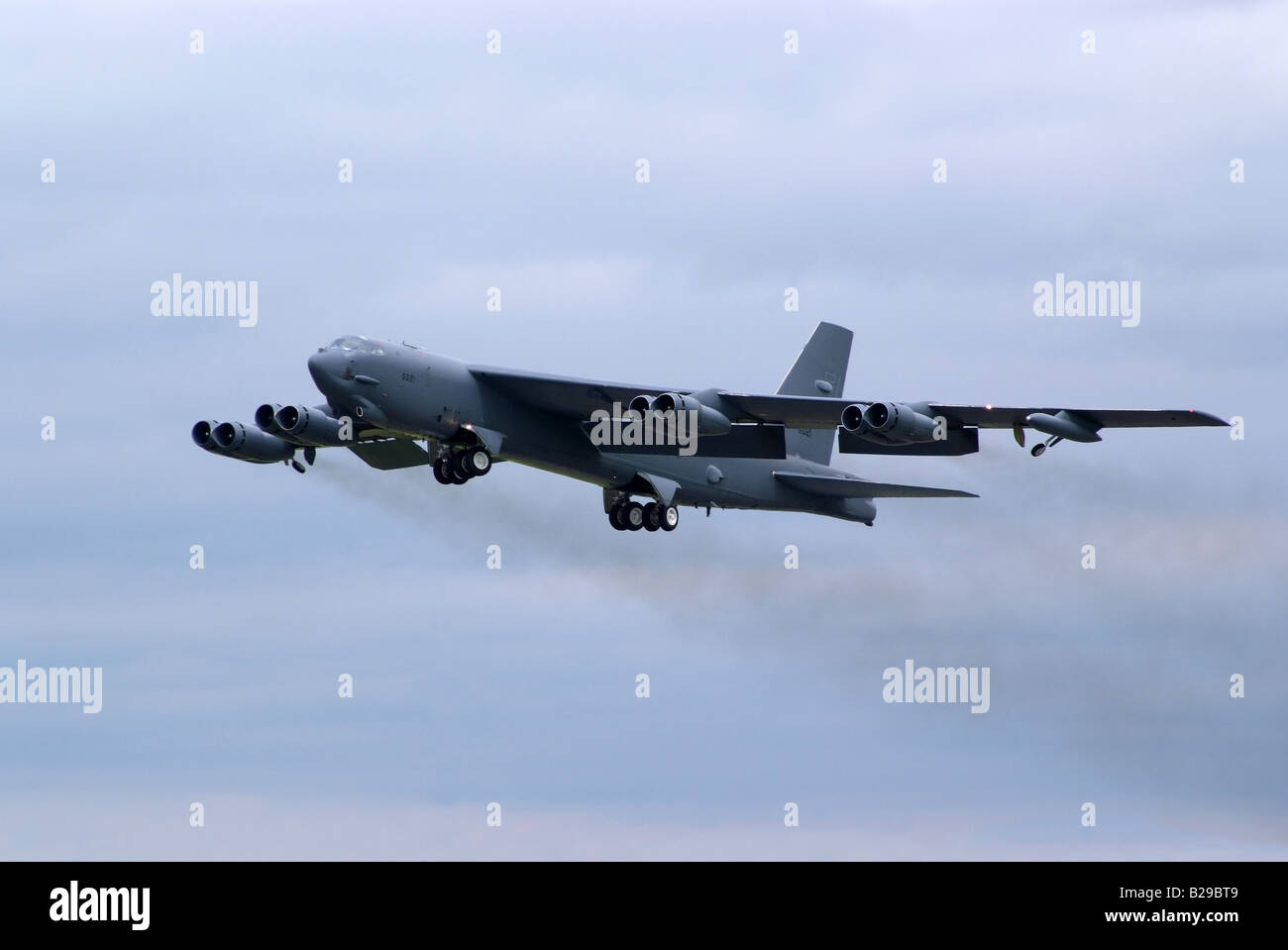 A USAF B-52 STRATOFORTRESS TAKING OFF FROM A BASE IN THE UK Stock Photo ...