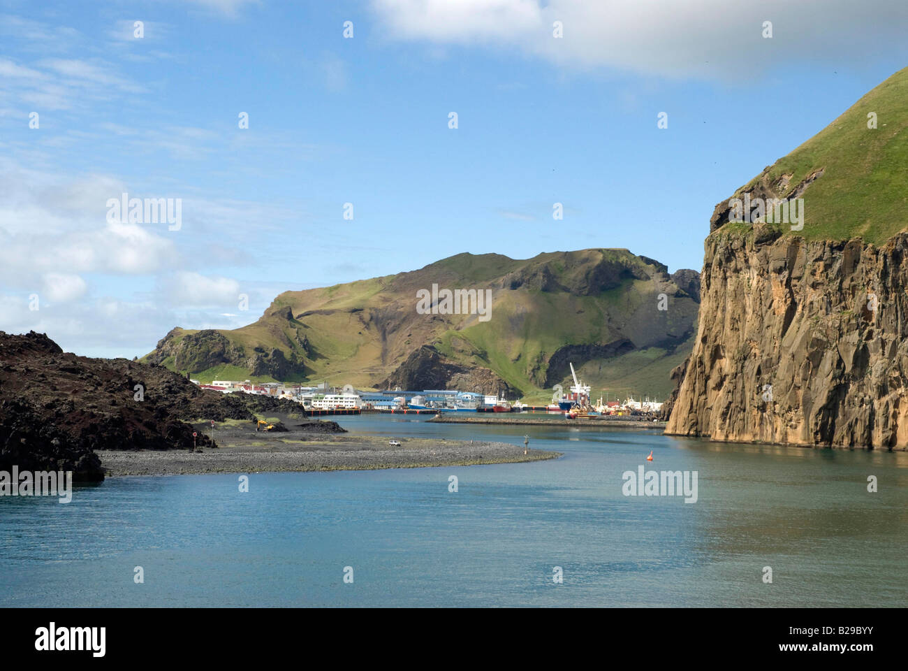Heimaey harbour entrance volcanic cliffs Westman Isles Iceland Stock ...