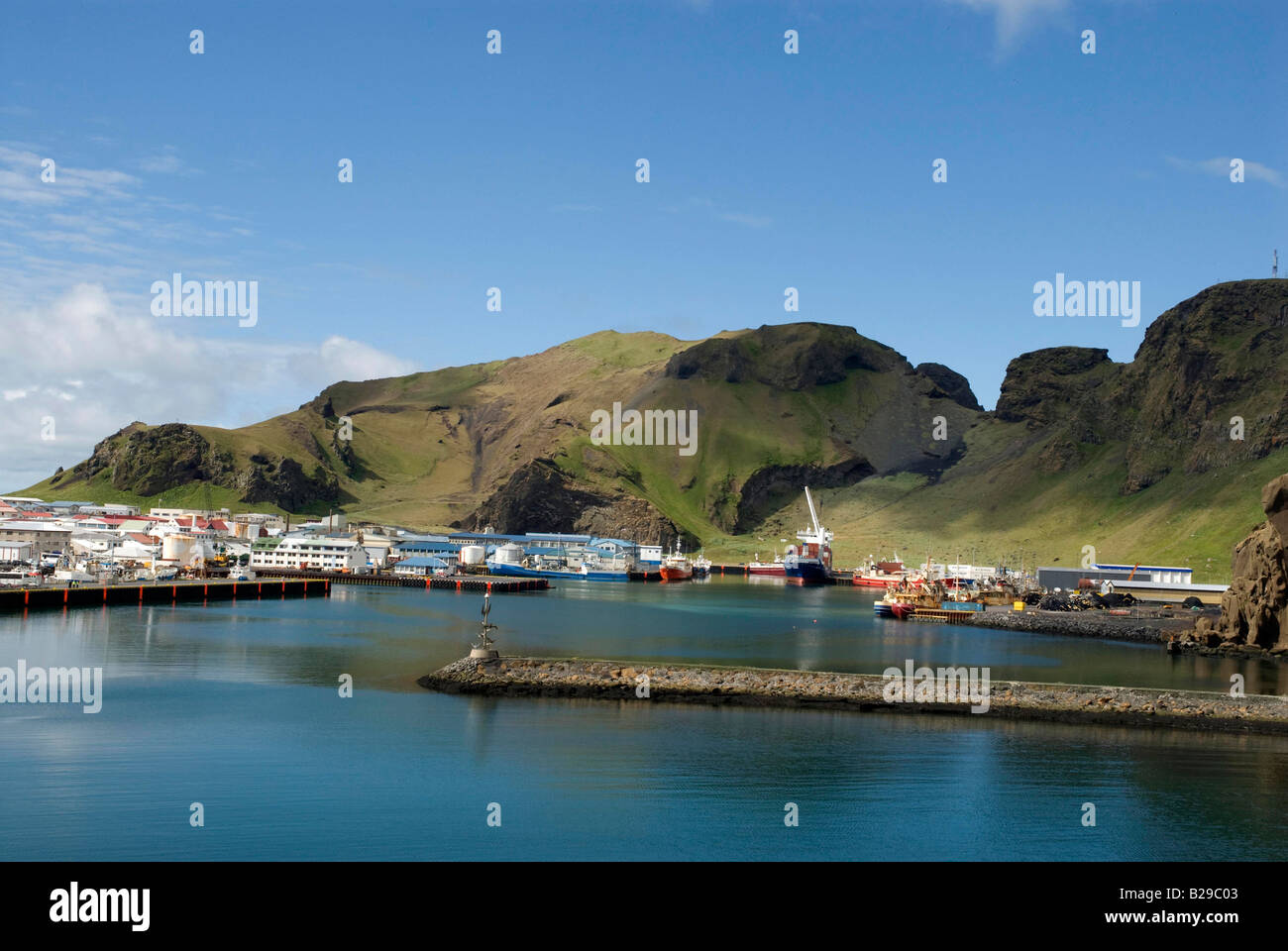 Heimaey harbour entrance volcanic cliffs Westman Isles Iceland Stock ...