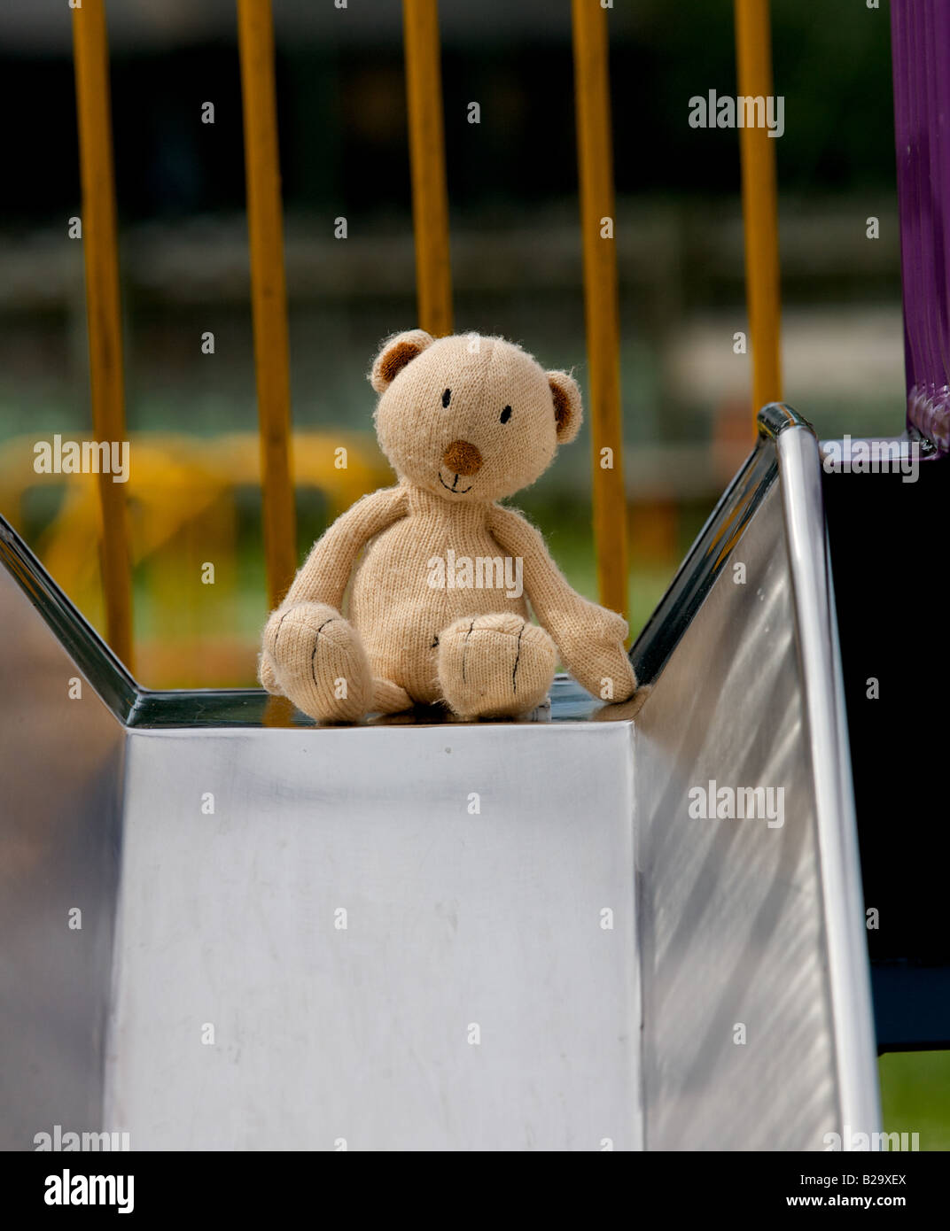 Childs toy on top of a slide Stock Photo - Alamy