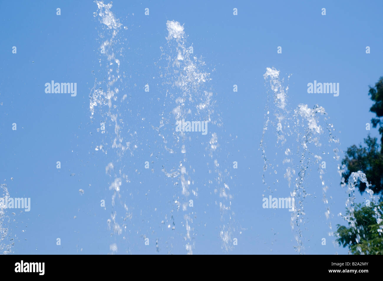 Water spray droplets with blue sky background Stock Photo - Alamy