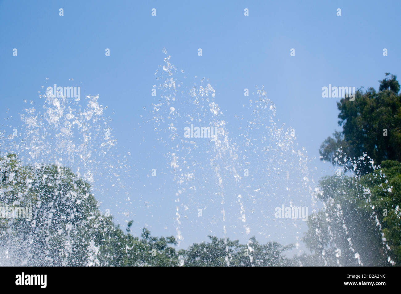 Water spray droplets with blue sky background Stock Photo - Alamy