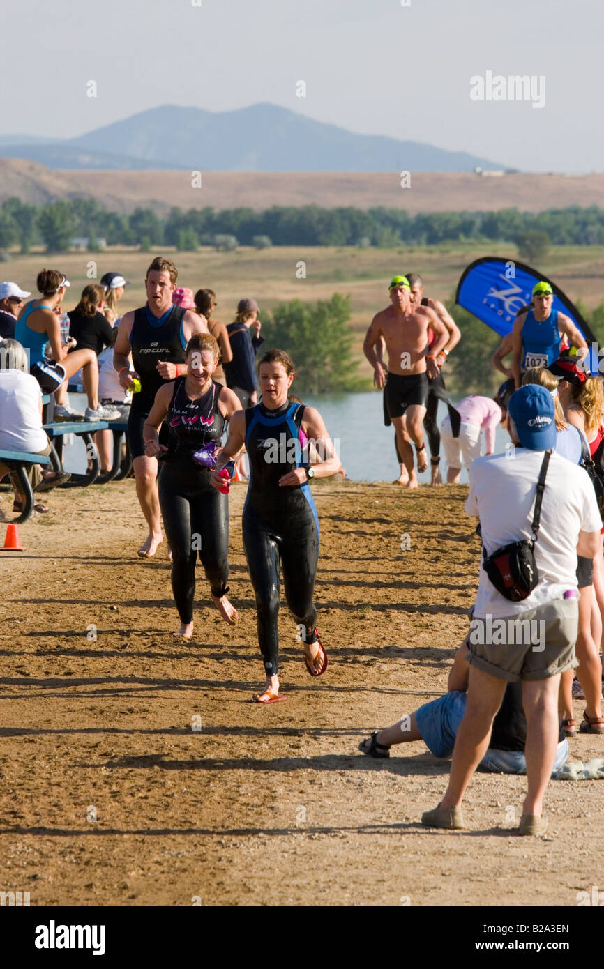 Women swimmers run beach hi-res stock photography and images - Alamy