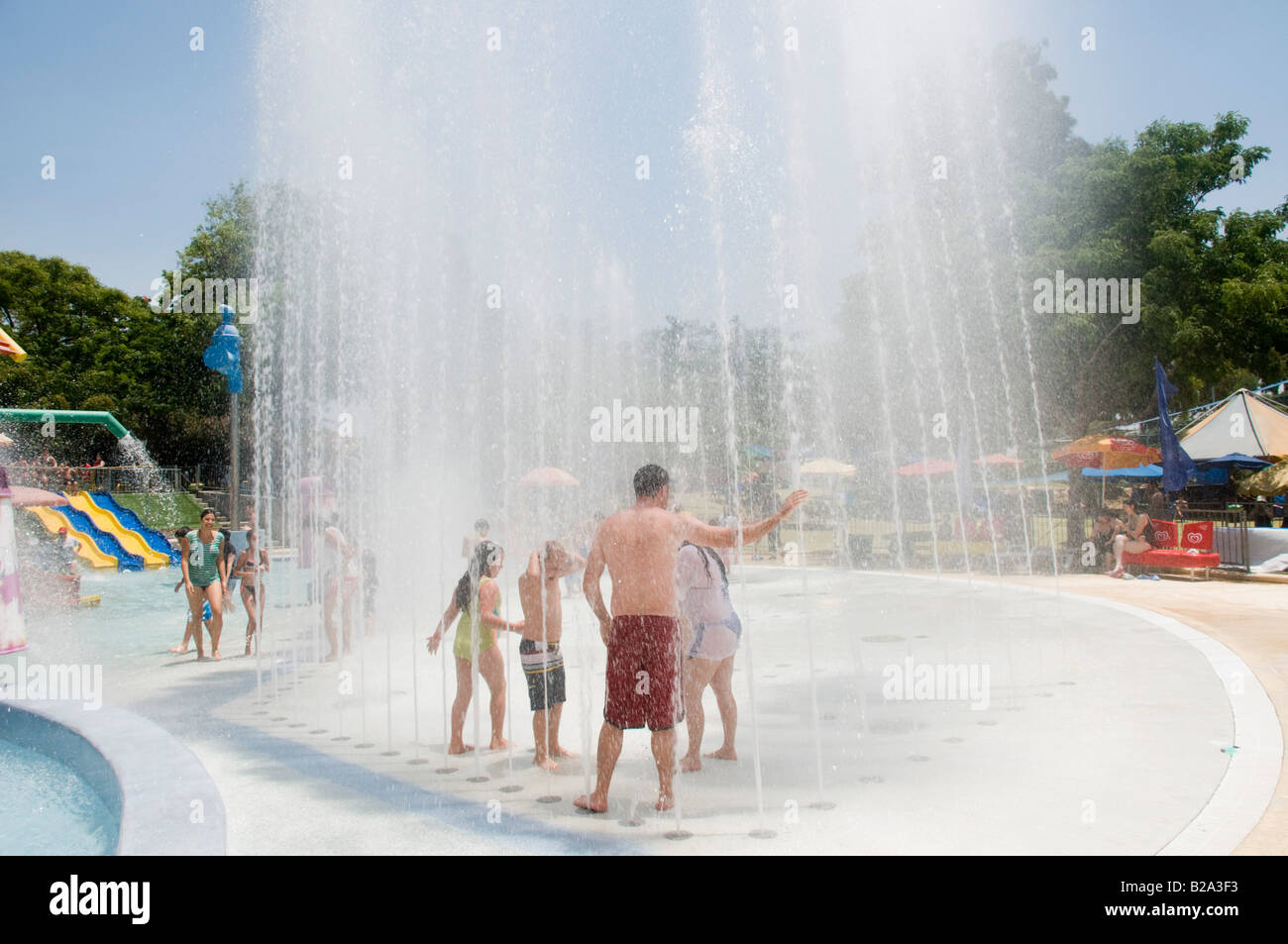 Israel Sfaim water Park summer fun children playing in water jets Stock ...