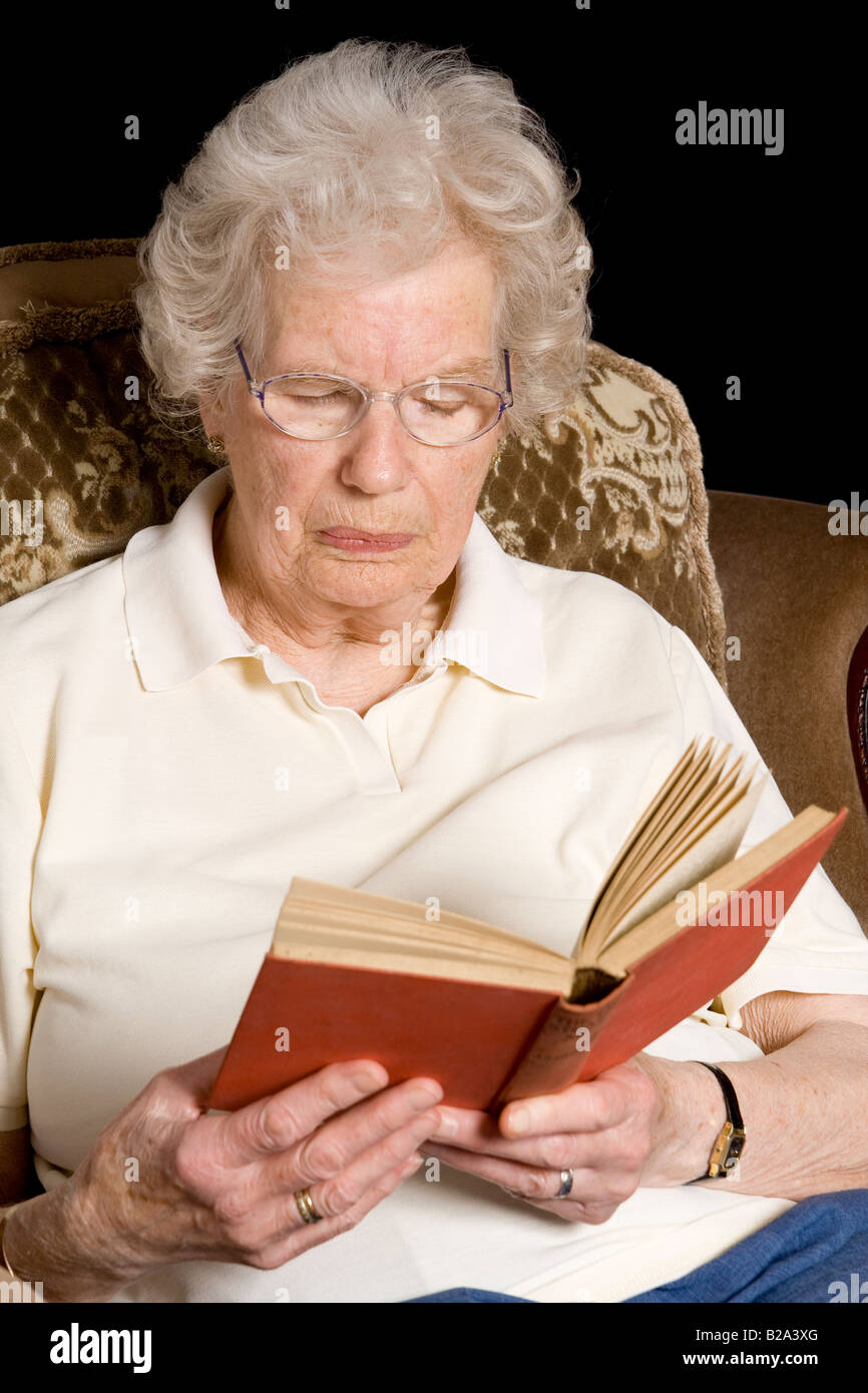 Old woman reading a book, UK Stock Photo - Alamy