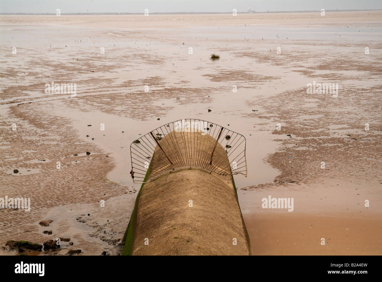 Sewage outlet pipe on a beach Stock Photo - Alamy