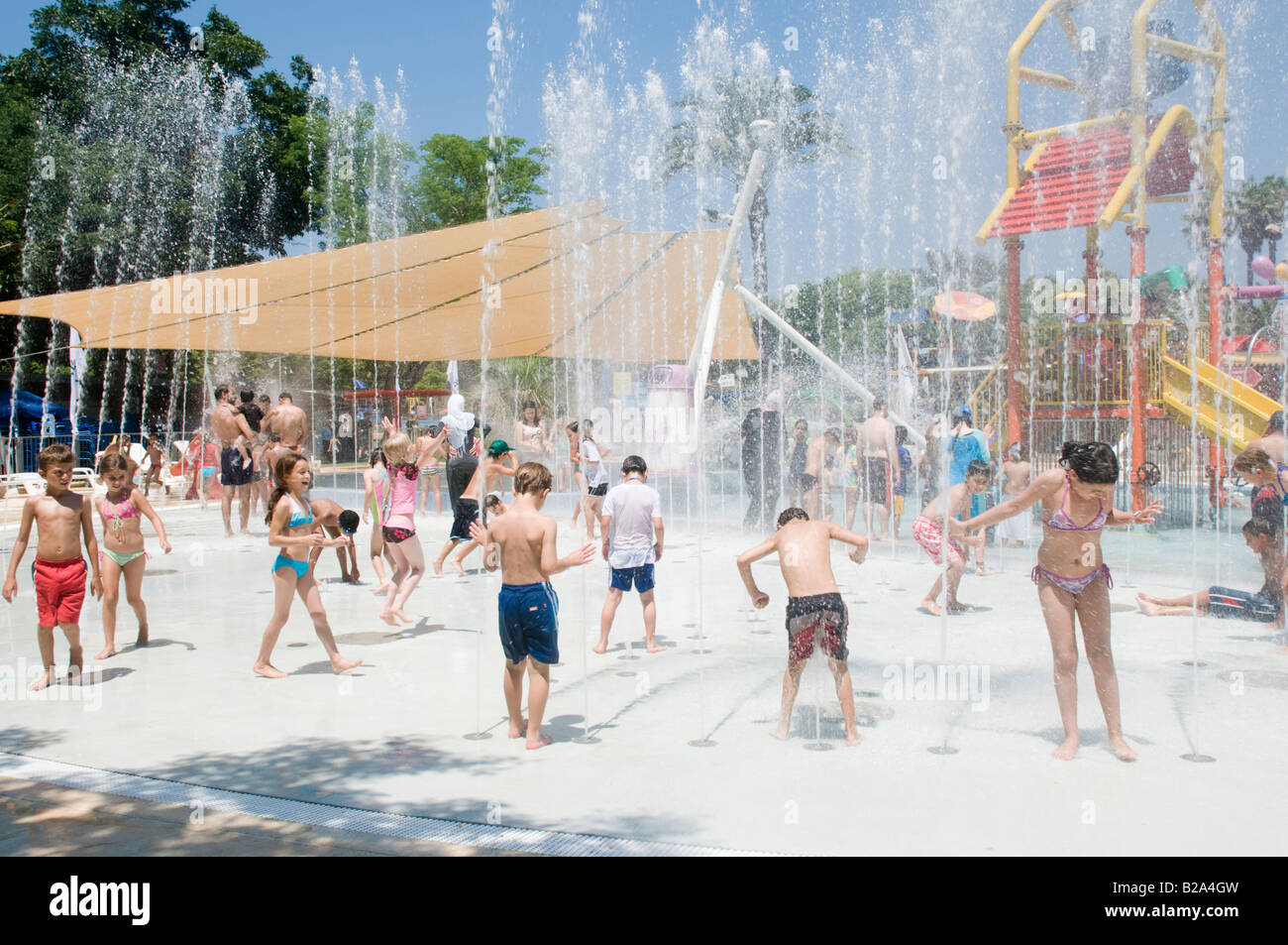 Israel Sfaim water Park summer fun children playing in water jets Stock ...