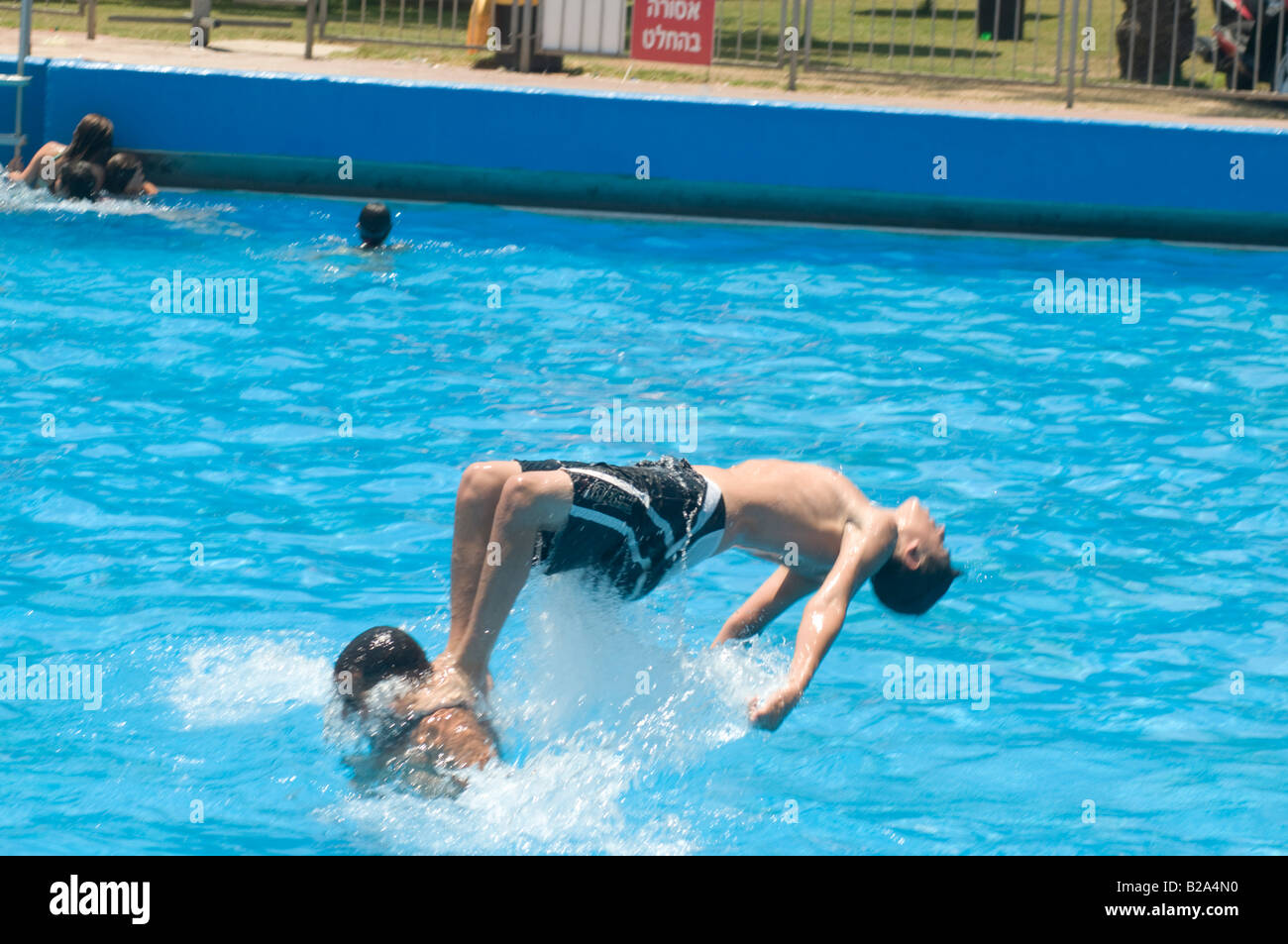 Israel Sfaim water Park summer fun somersault in a pool Stock Photo - Alamy