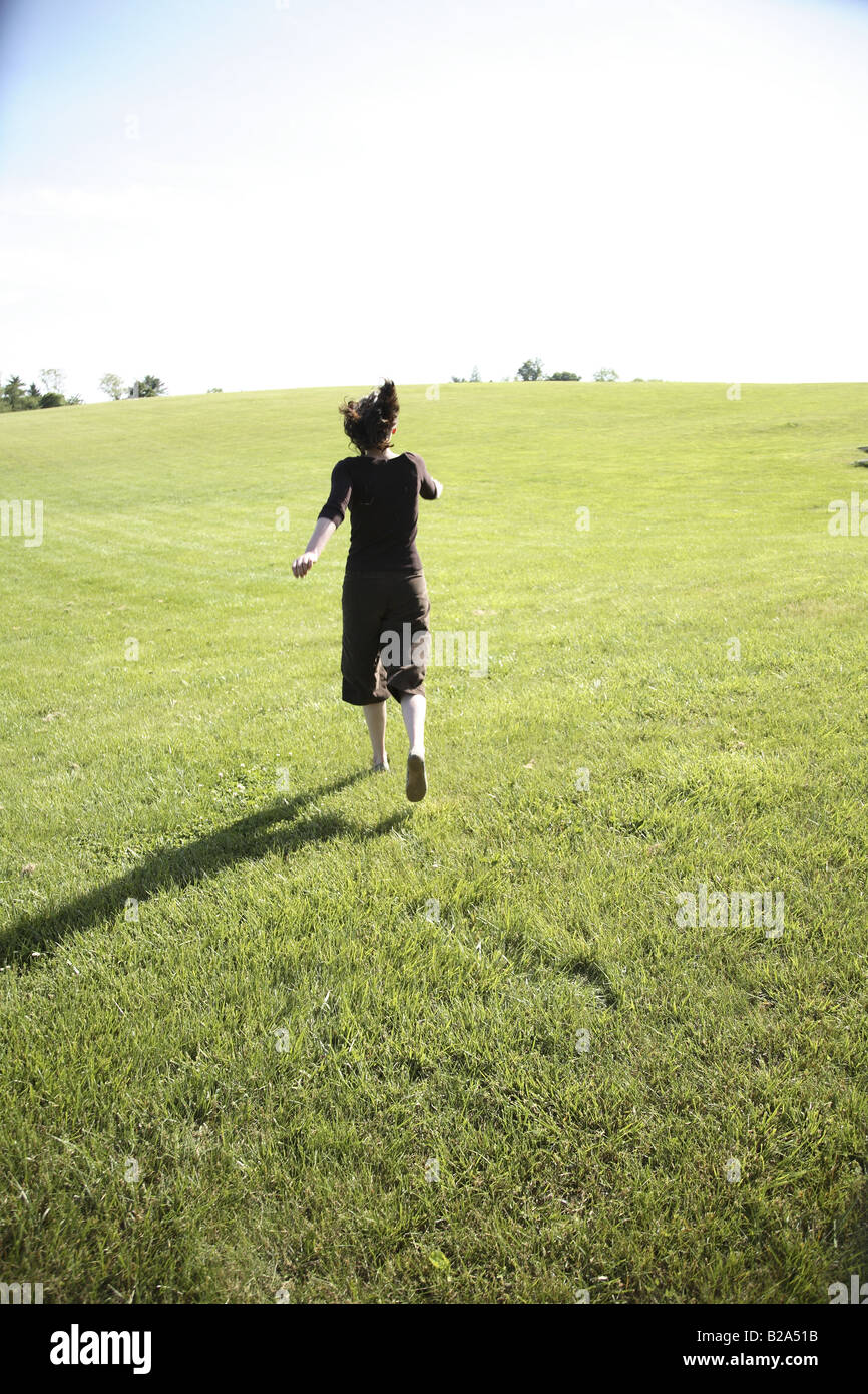 woman walking in field Stock Photo - Alamy