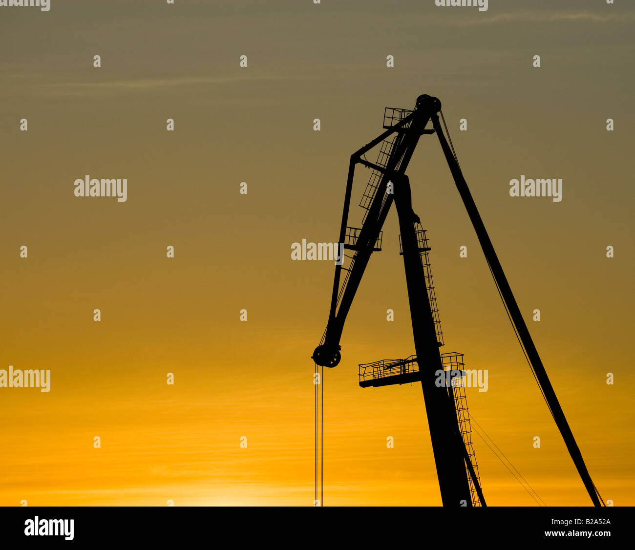Construction crane over sunset hi-res stock photography and images - Alamy