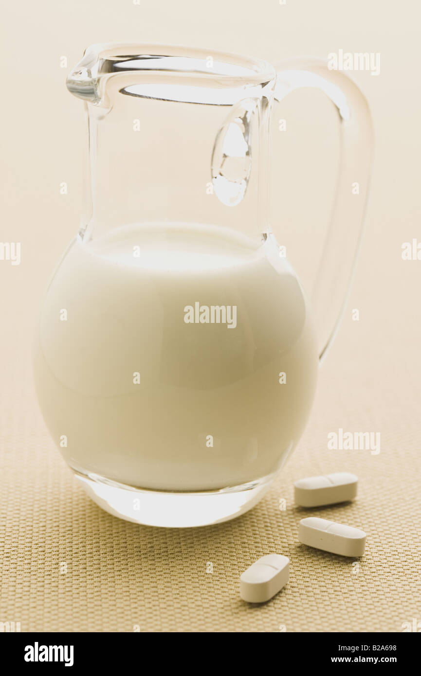 A shot of milk and vitamins Stock Photo - Alamy
