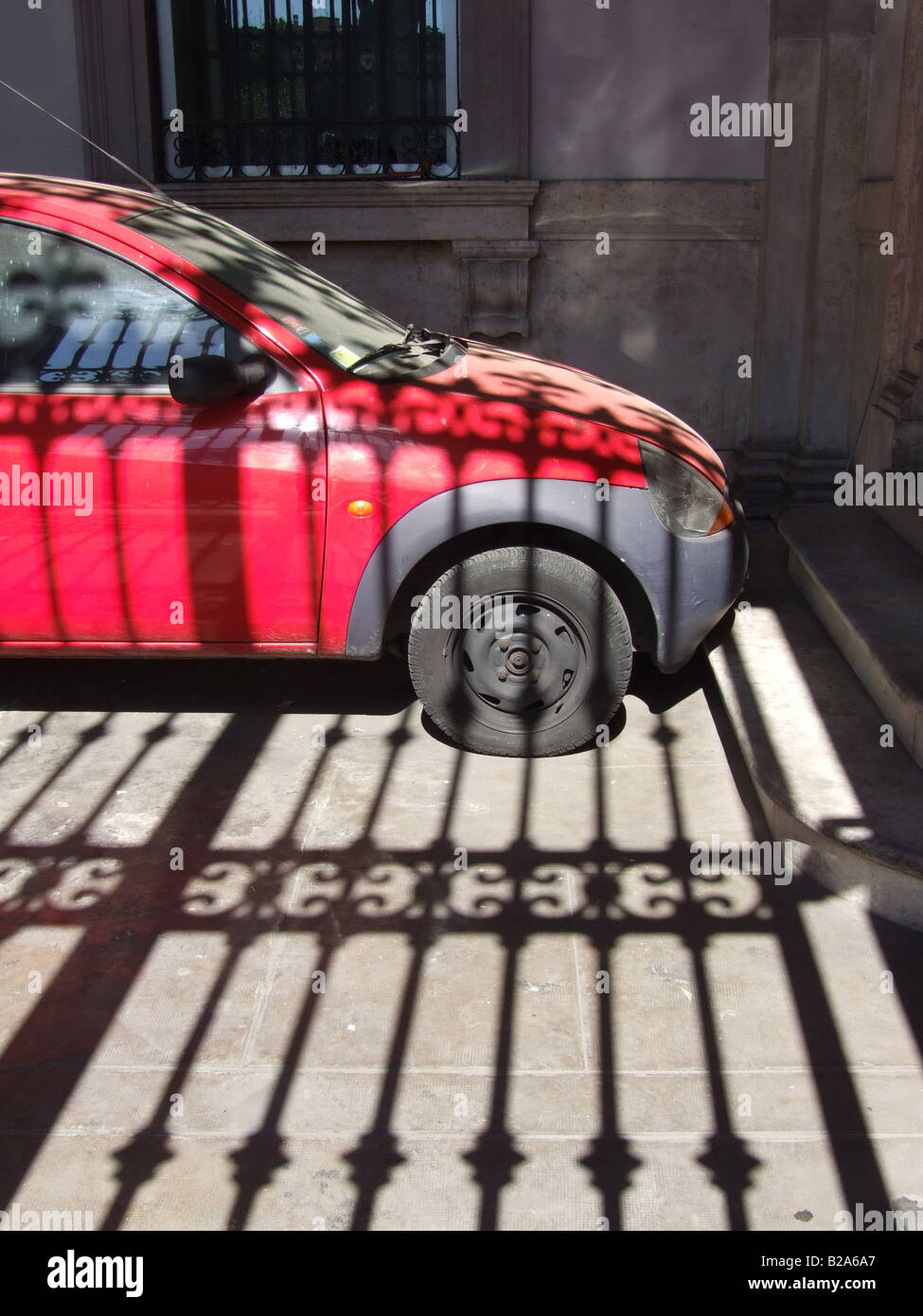 detail of sun fence shadow on car body in street Stock Photo - Alamy