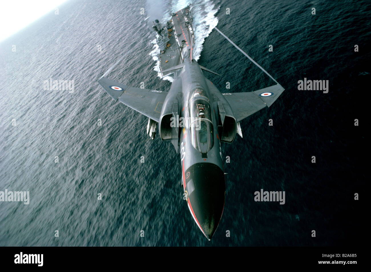 Phantom F4 jet aircraft with aircraft carrier in background Stock Photo ...