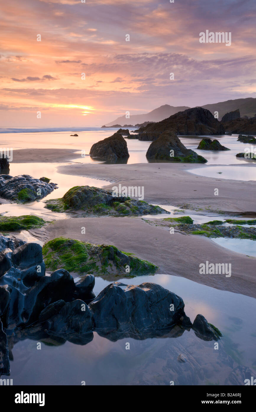 Rockpools and sand at Combesgate Beach, Woolacombe, North Devon England ...