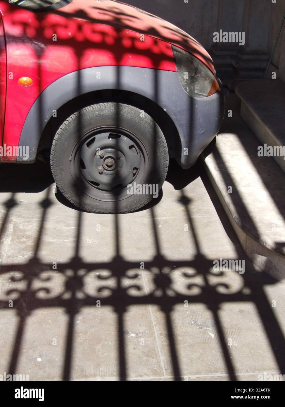 detail of sun fence shadow on car body in street Stock Photo - Alamy