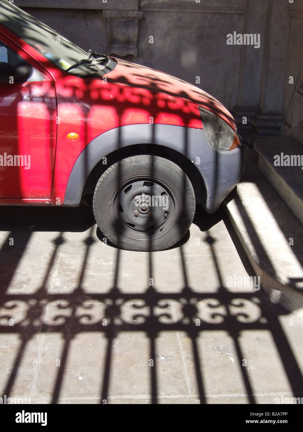 detail of sun fence shadow on car body in street Stock Photo - Alamy