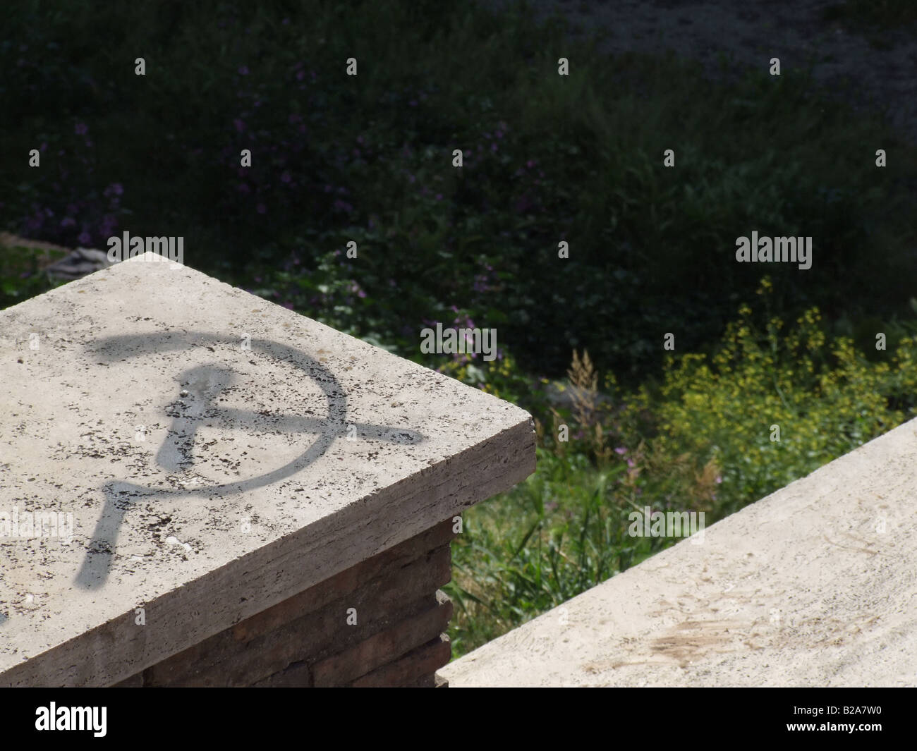 communist symbol written on park bench Stock Photo - Alamy