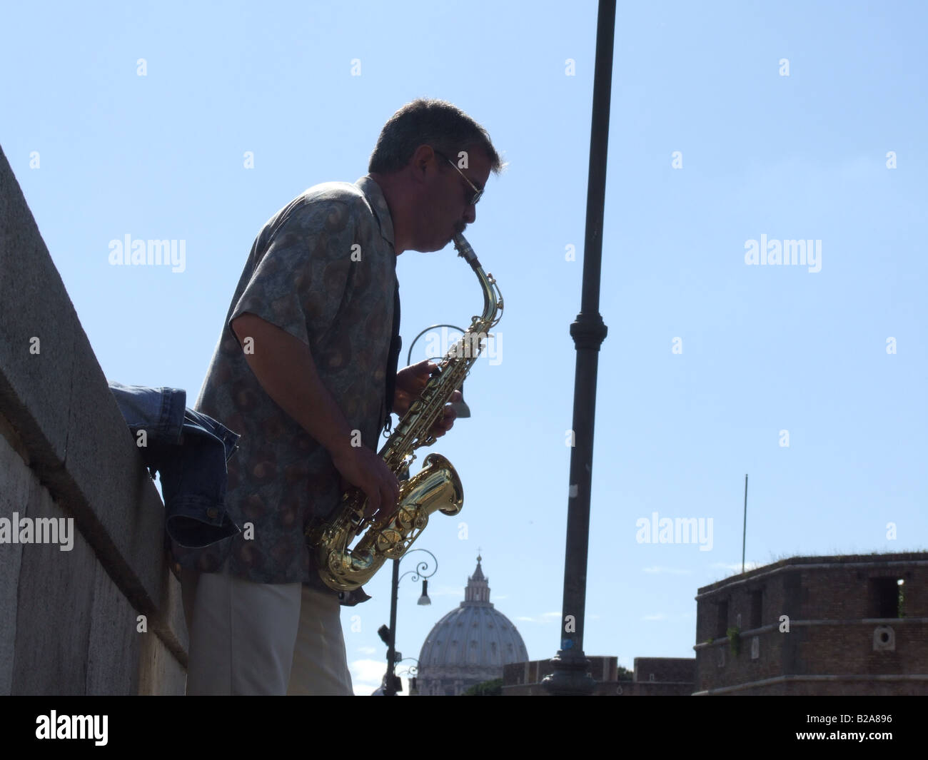 man busker playing saxophone in street in rome Stock Photo - Alamy