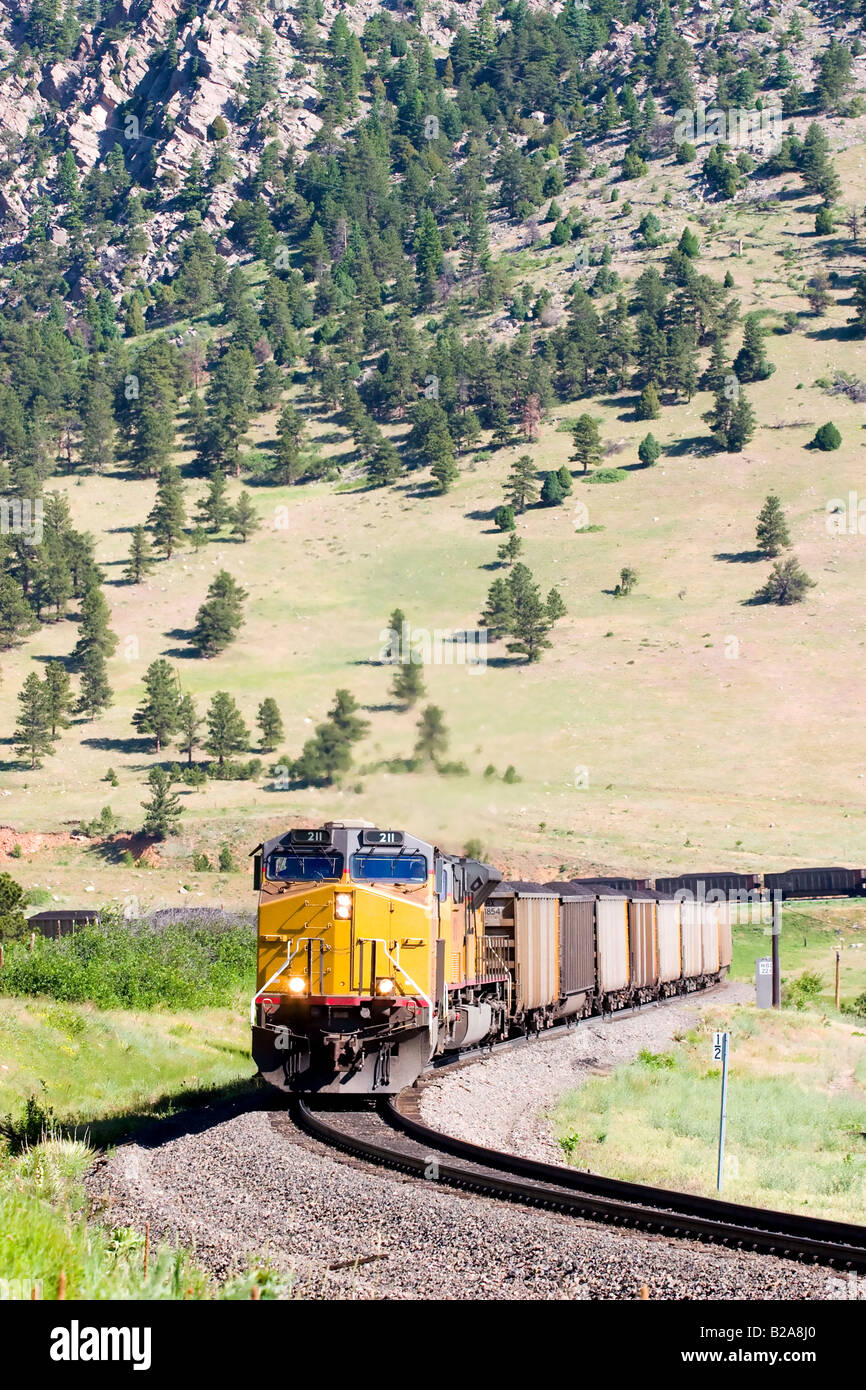 A coal train descends the Rocky Mountains approaching Denver, CO Stock ...