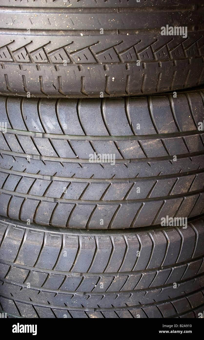 A stack of used tires in the garage Stock Photo - Alamy