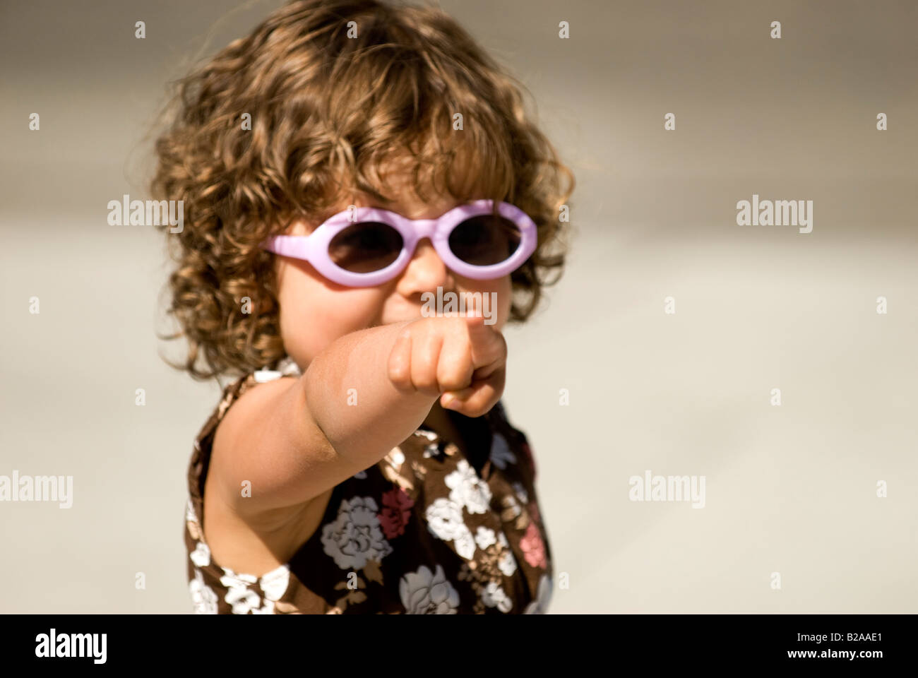 Girl points ahead Stock Photo - Alamy